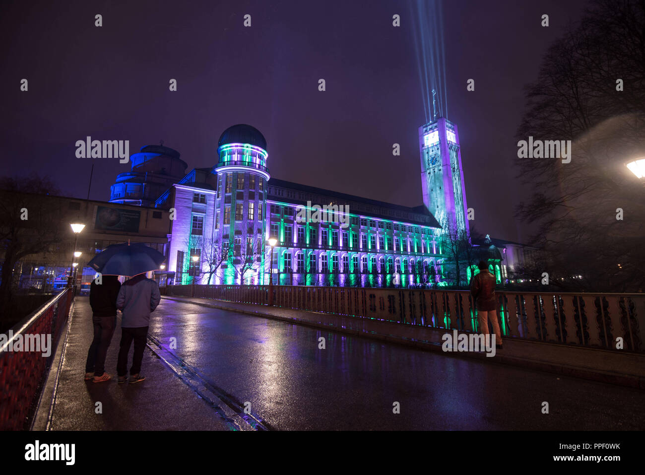 The facade of the Deutsches Museum shines in colorful lighting for the ...