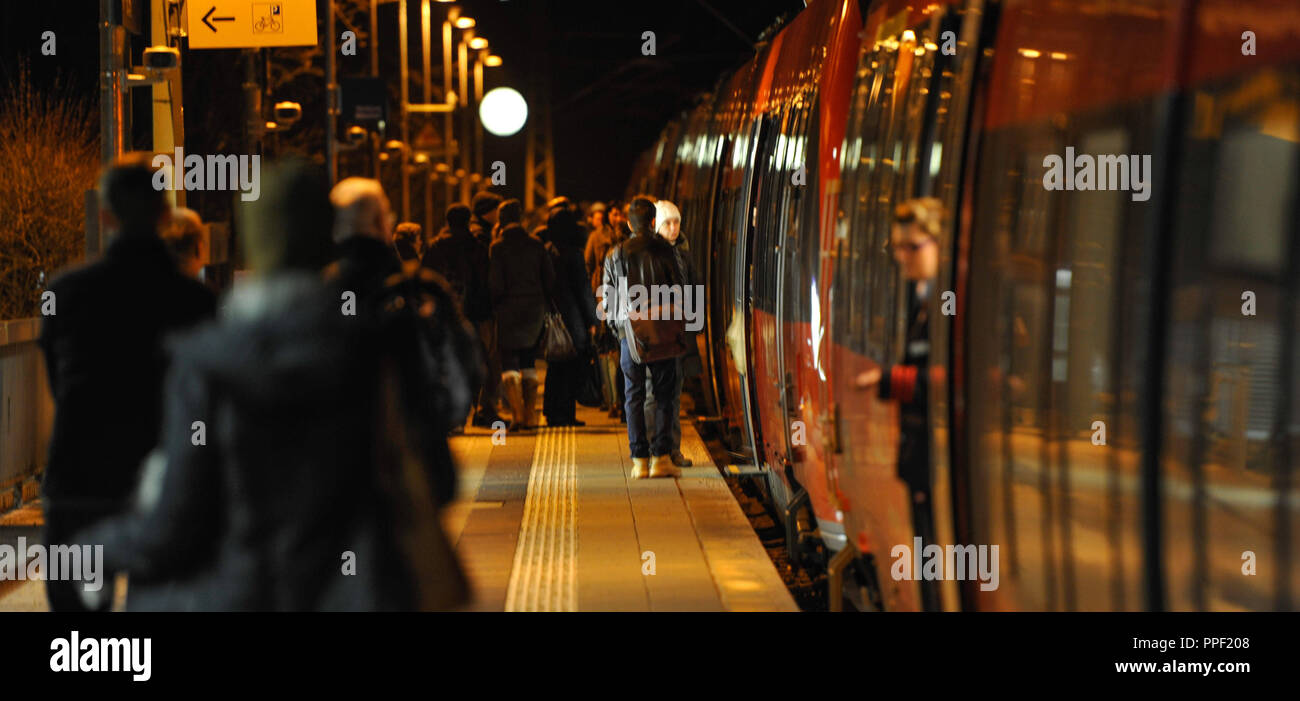 Passengers getting on a train in Tutzig, Bavaria, Germany Stock Photo ...