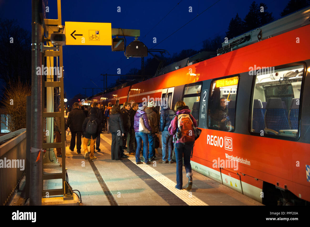 Passengers getting on a train in Tutzig, Bavaria, Germany Stock Photo ...