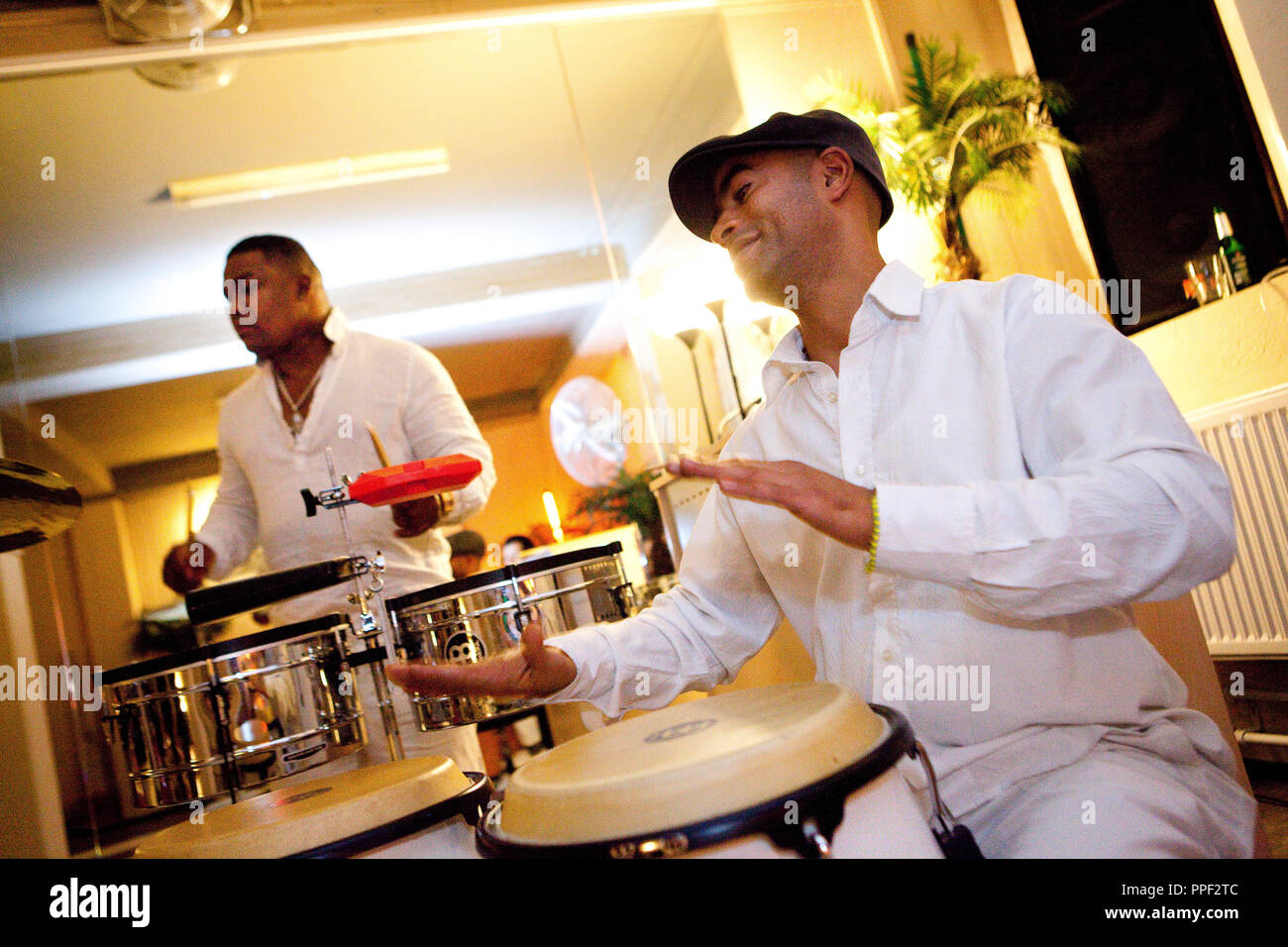 Drummers at a salsa dance party at 'Salsabor' on Schelling street Stock ...