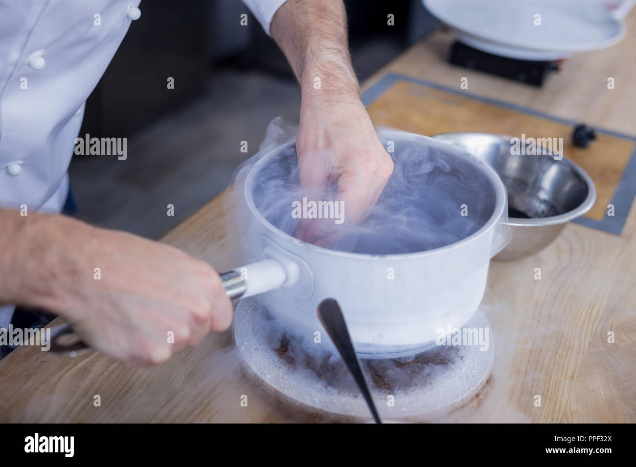 Talented cook practicing molecular gastronomy in the kitchen Stock ...