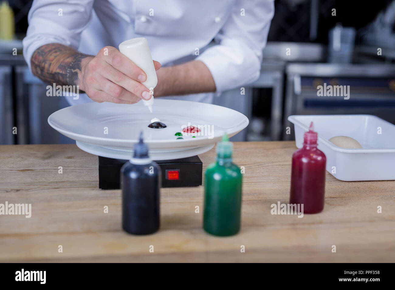 Good cook mixing different ingredients for a dish Stock Photo - Alamy