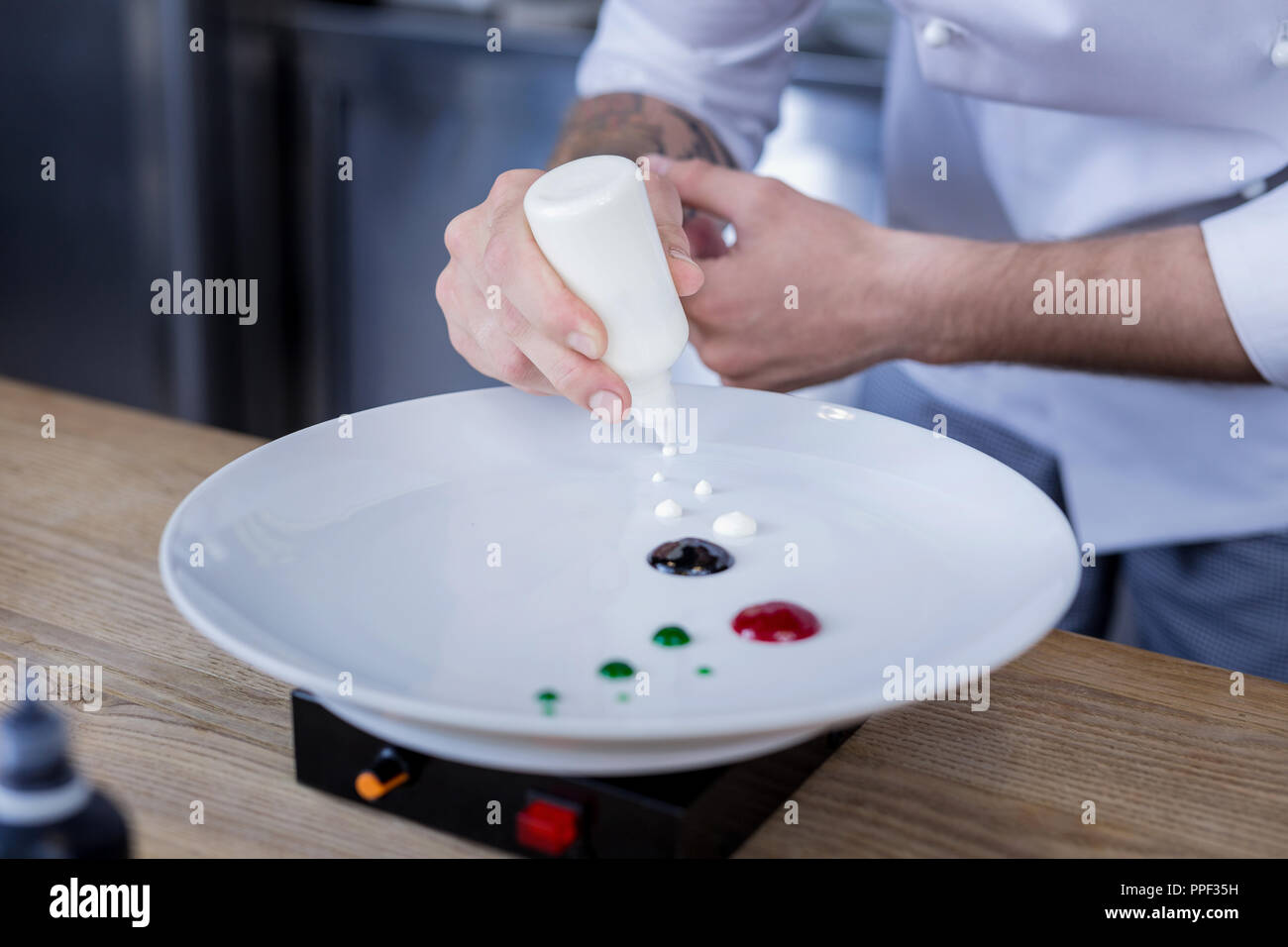 Patient cook preparing every ingredient for a dish Stock Photo - Alamy
