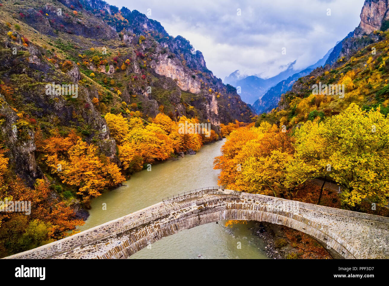 Aerial view of Konitsa old bridge and Aoos River an autumn day, Greece ...