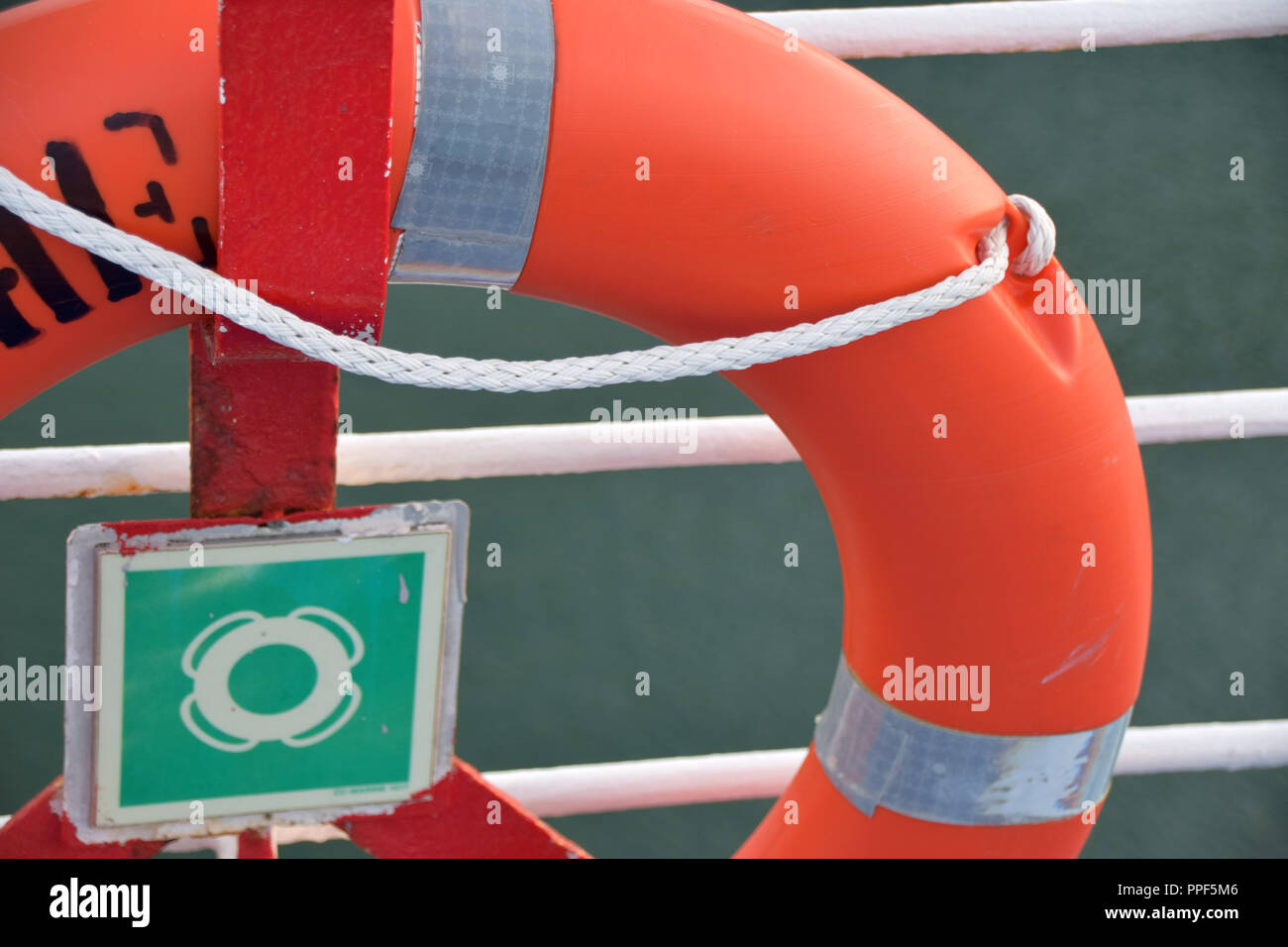 close-up view of a lifebuoy on the railing of a ship, a part of a ...