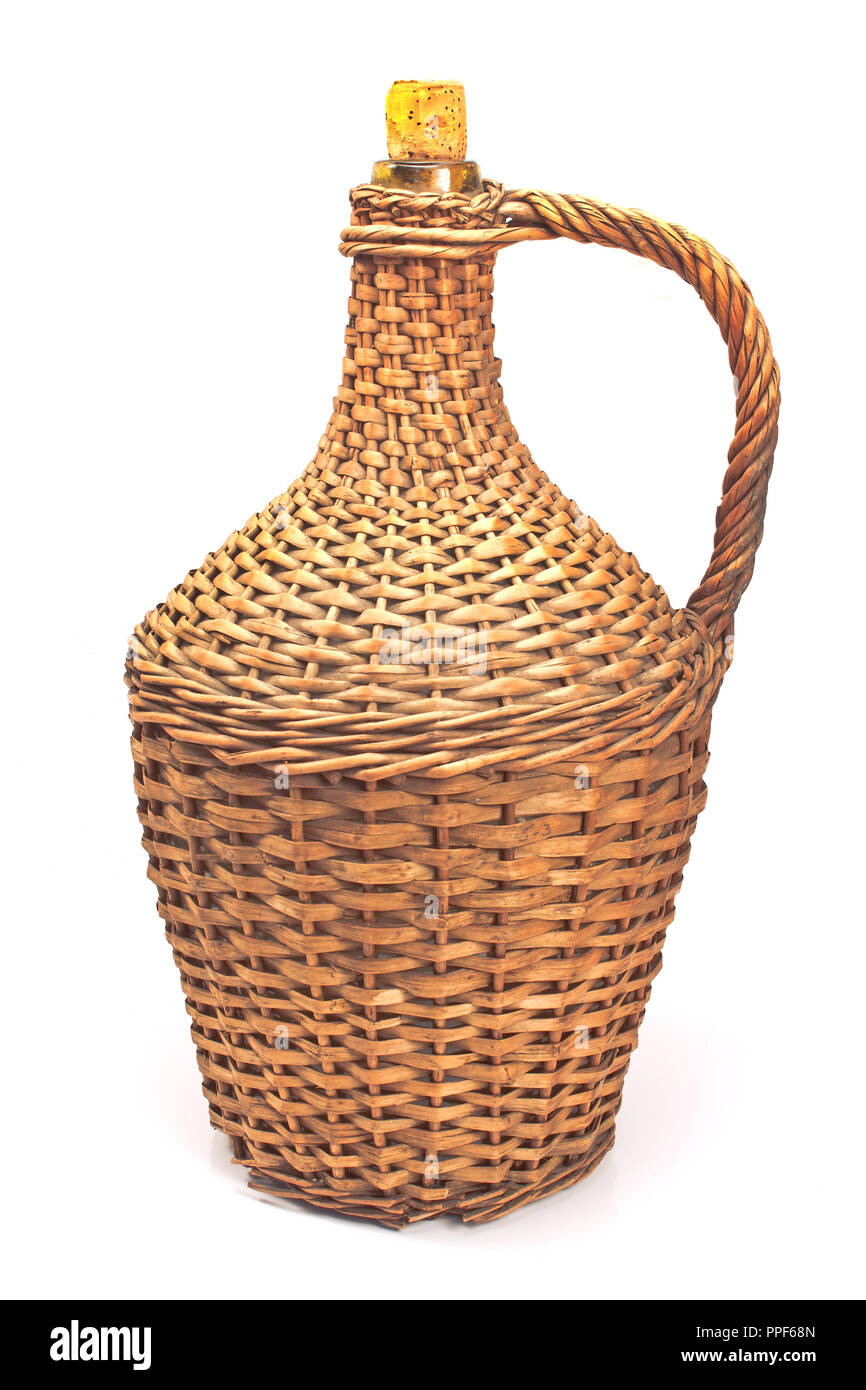 Old demijohn wicker wrapped glass bottle isolated on white Stock Photo ...