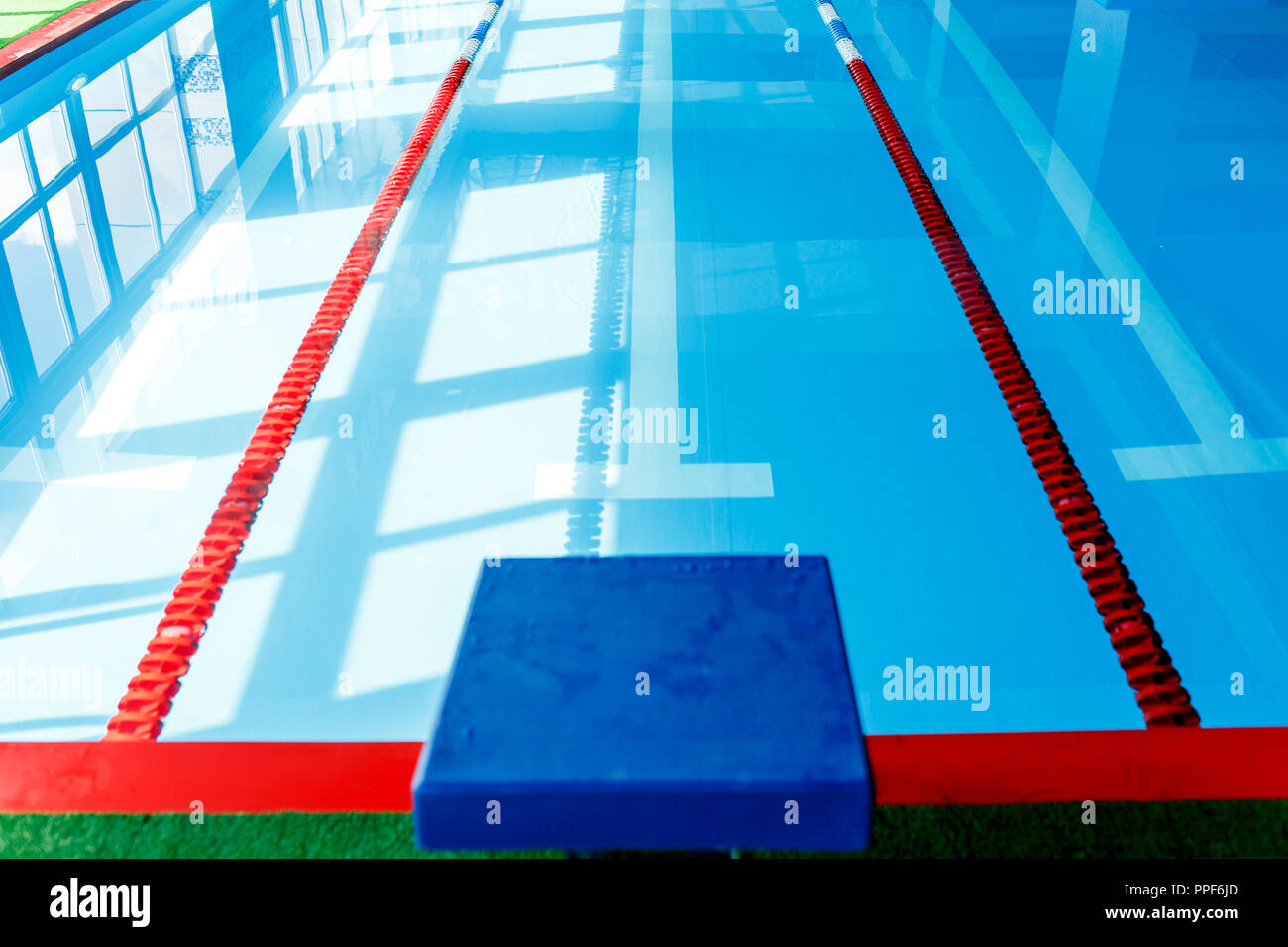 Photo from top of swimming pool with markings on bottom, with red ...