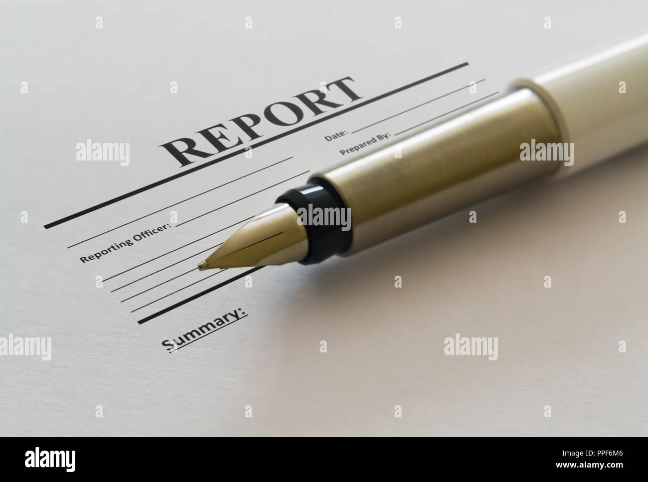 Closeup of a fountain pen and blank report form Stock Photo - Alamy