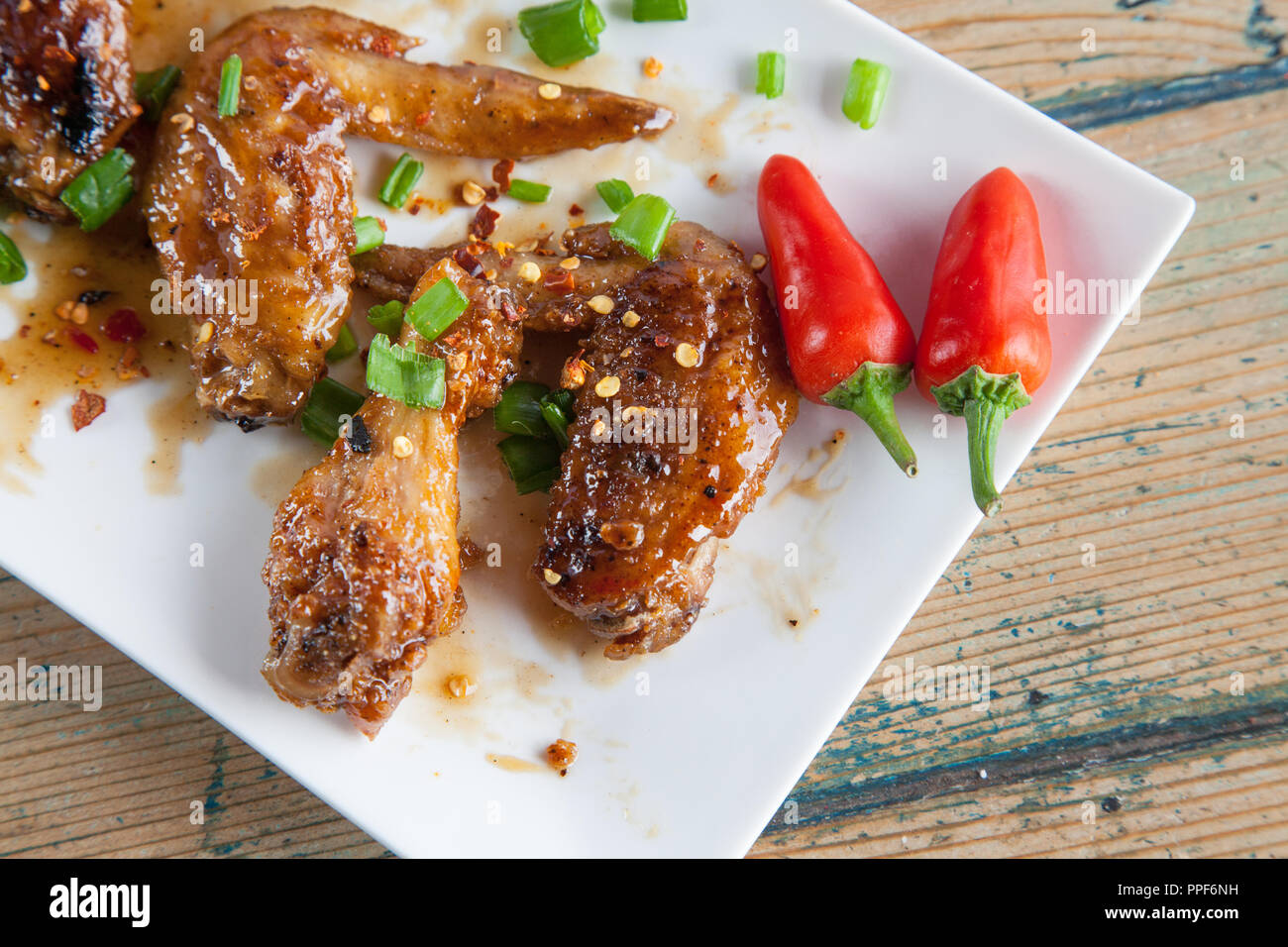 Spicy Red Chilli Chicken Wings Stock Photo - Alamy