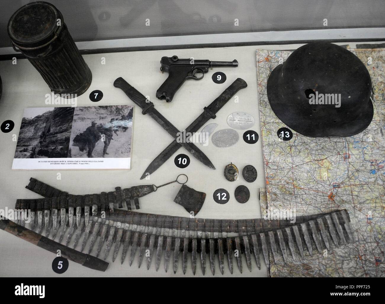 Showcase with material and weapons used by soldiers during World War II ...