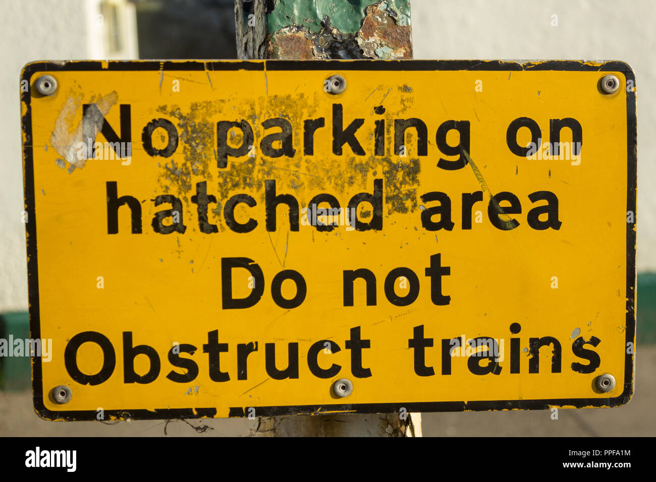Close-up of a No parking sign next to the disused tramway in Weymouth ...