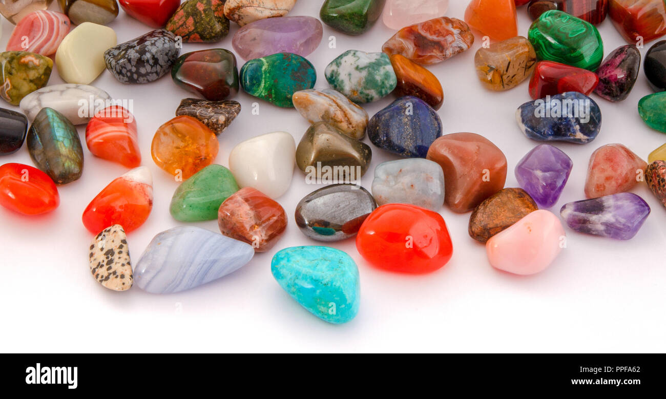 Polished gemstones background image. Group of polished semi-precious ...