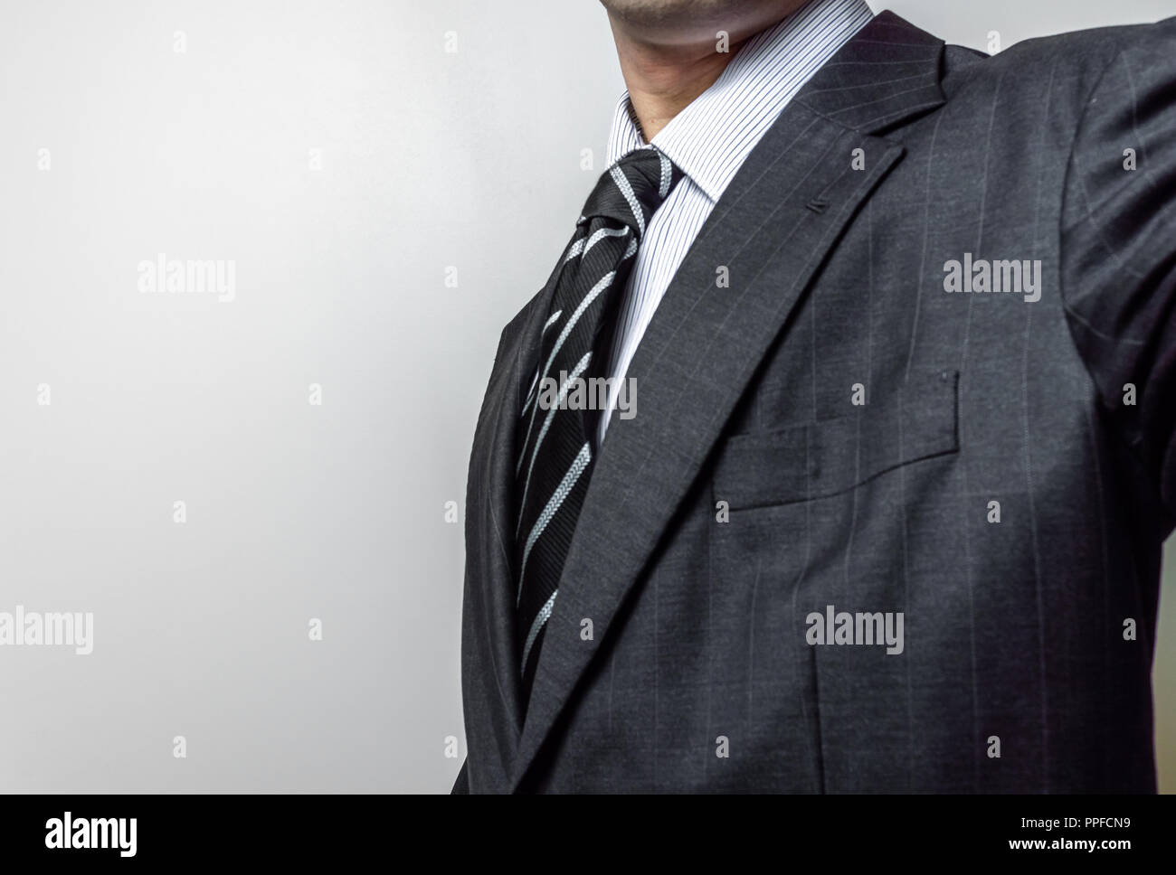 Chest of a man wearing suit and tie Stock Photo - Alamy