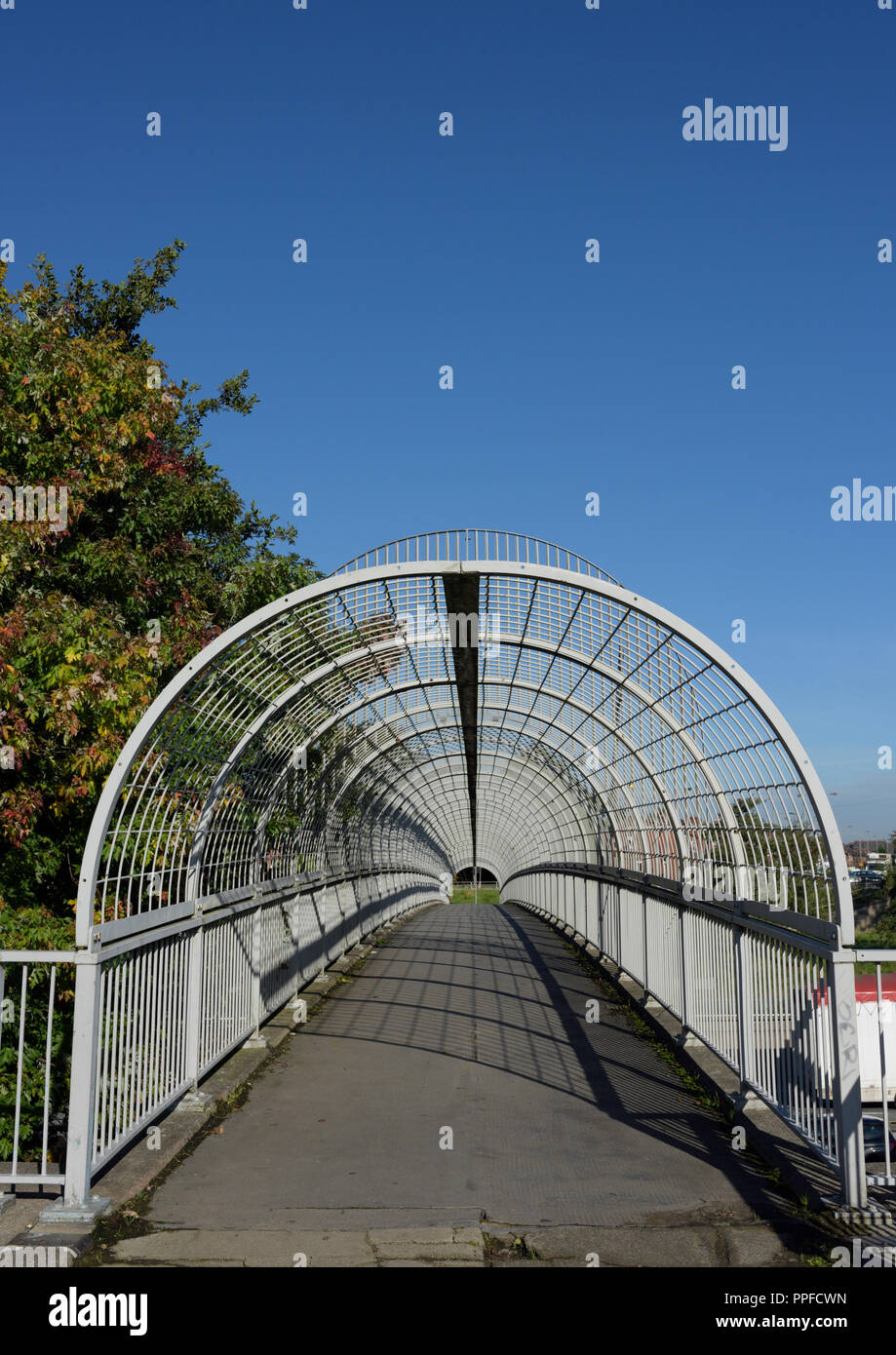 Enclosed pedestrian footbridge with steel safety cage, over m60 ...