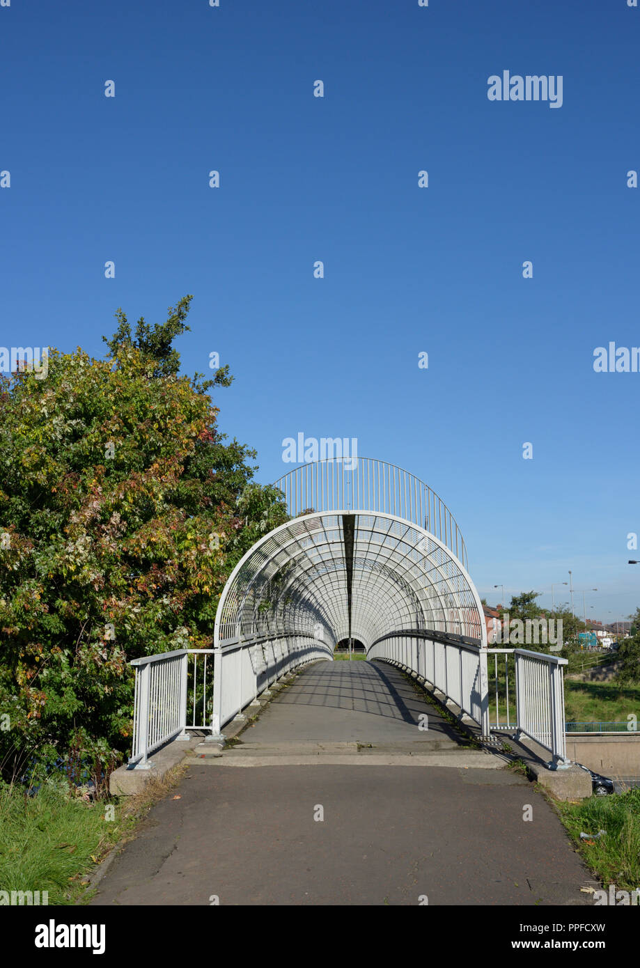 Enclosed pedestrian footbridge with steel safety cage, over m60 ...