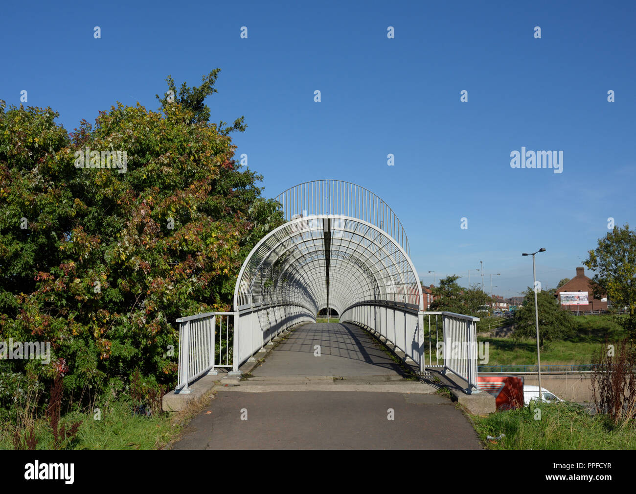 Enclosed pedestrian footbridge with steel safety cage, over m60 ...
