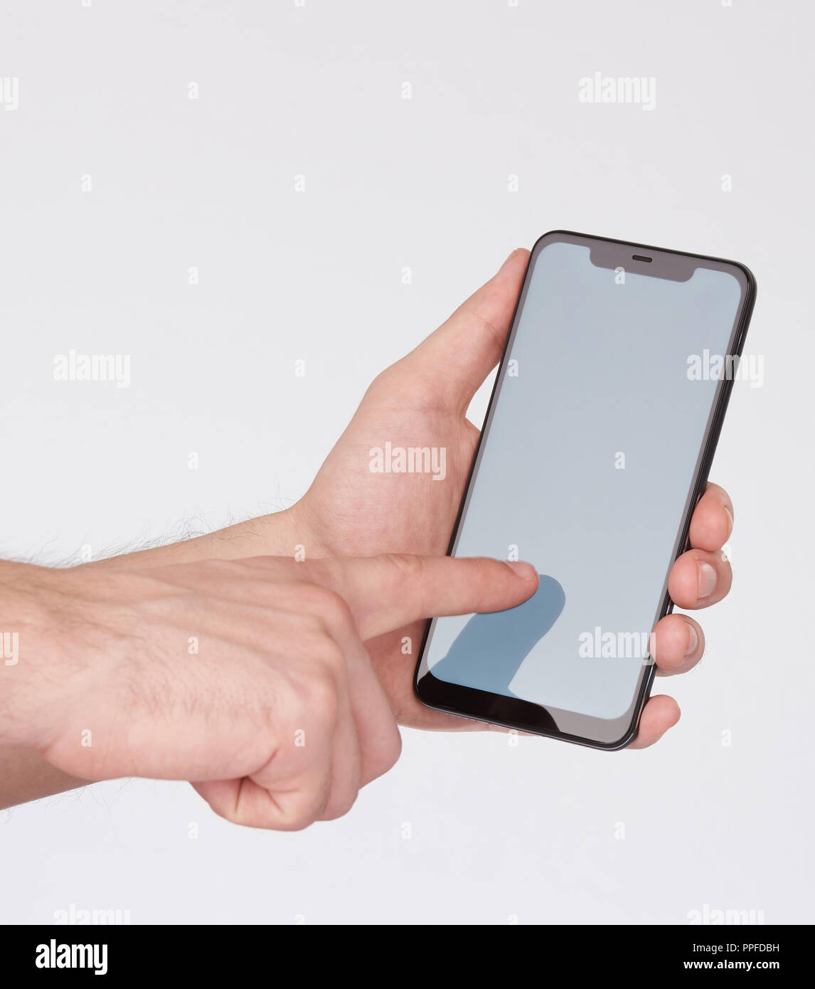 Using smartphone with notch isolated on white studio background Stock ...