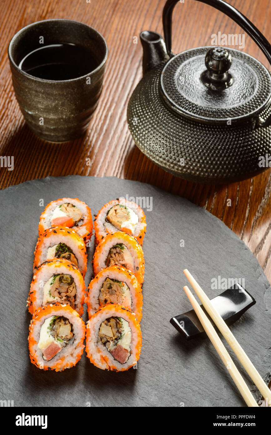 Rolls and cast-iron teapot Stock Photo - Alamy
