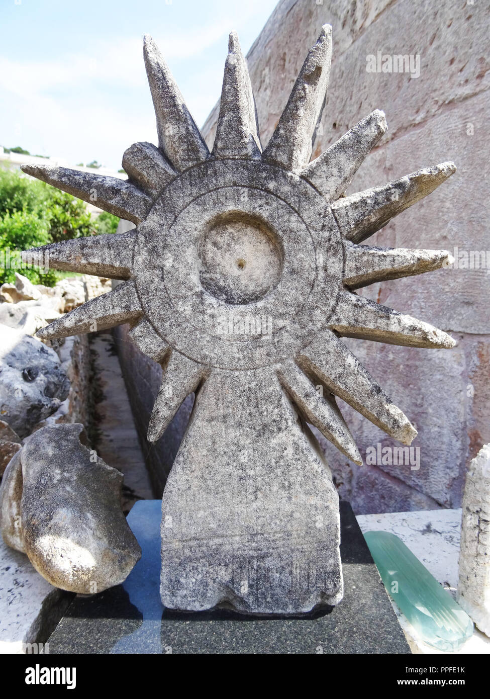 Beautiful old stone sculpture representing star or stone sun rays ...