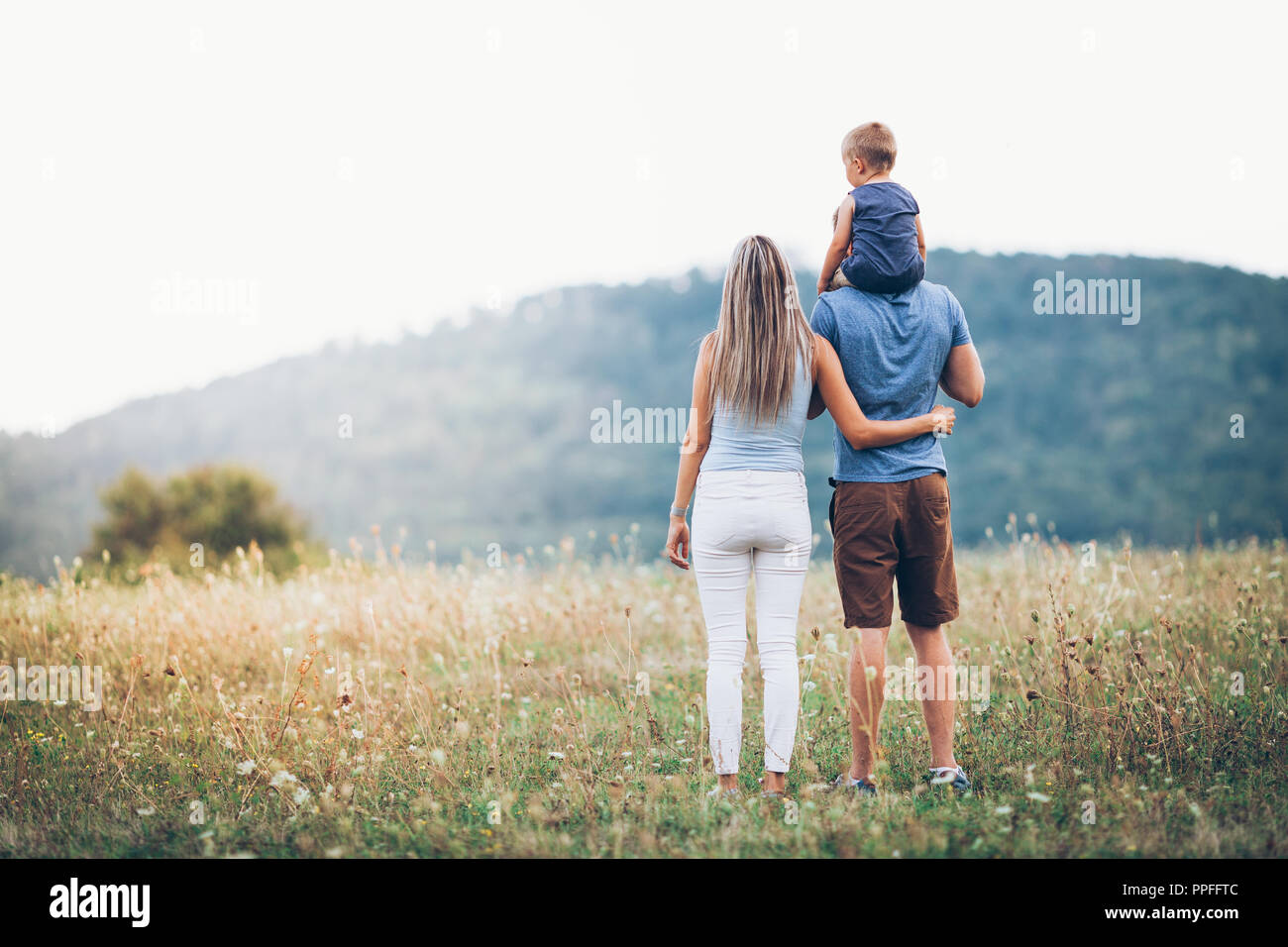 Happy family enjoying time spent together outdoors Stock Photo - Alamy