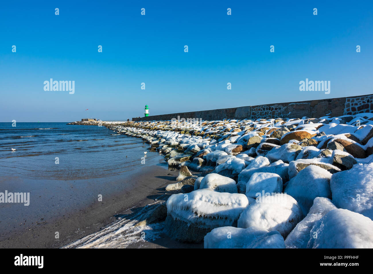 Mole in winter time in Warnemuende, Germany Stock Photo - Alamy