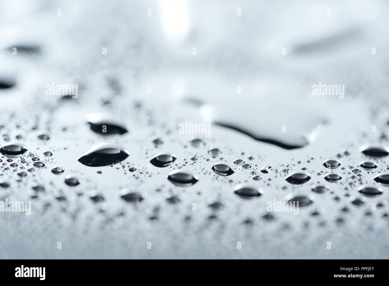 close up view of water drops on grey surface as background Stock Photo ...