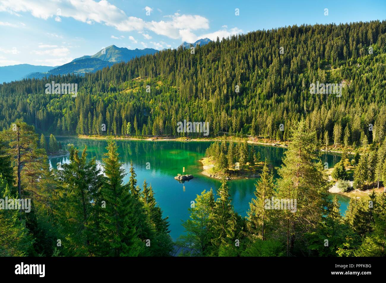 Lake Cauma with island, bathing lake in the Flims large forest, Flims ...