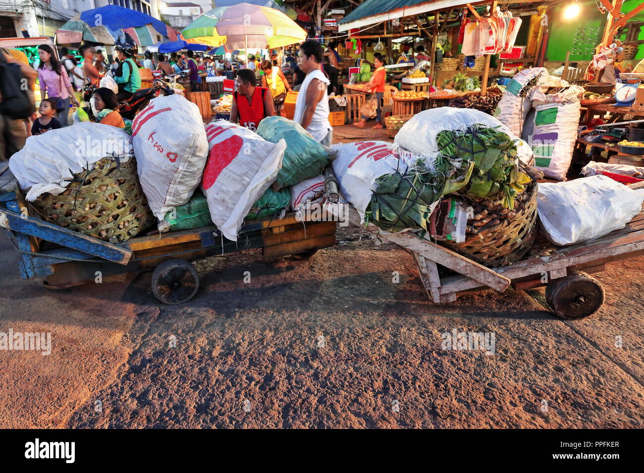 Cebu, Philippines-October 18, 2016: Porters take a break while carrying ...