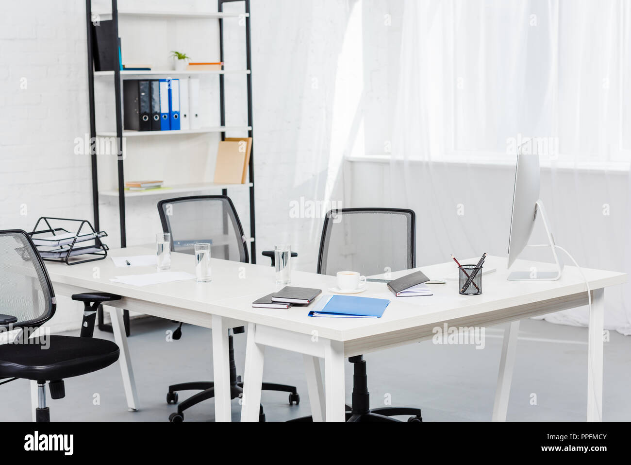 interior of empty office with computer on desk Stock Photo - Alamy