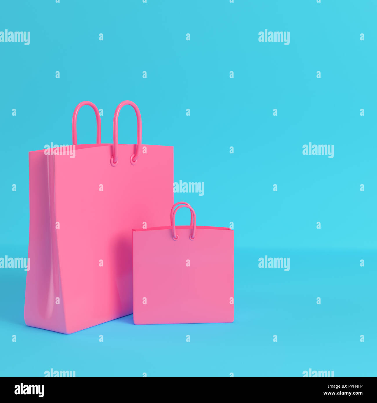 Pink shopping bags on bright blue background in pastel colors ...