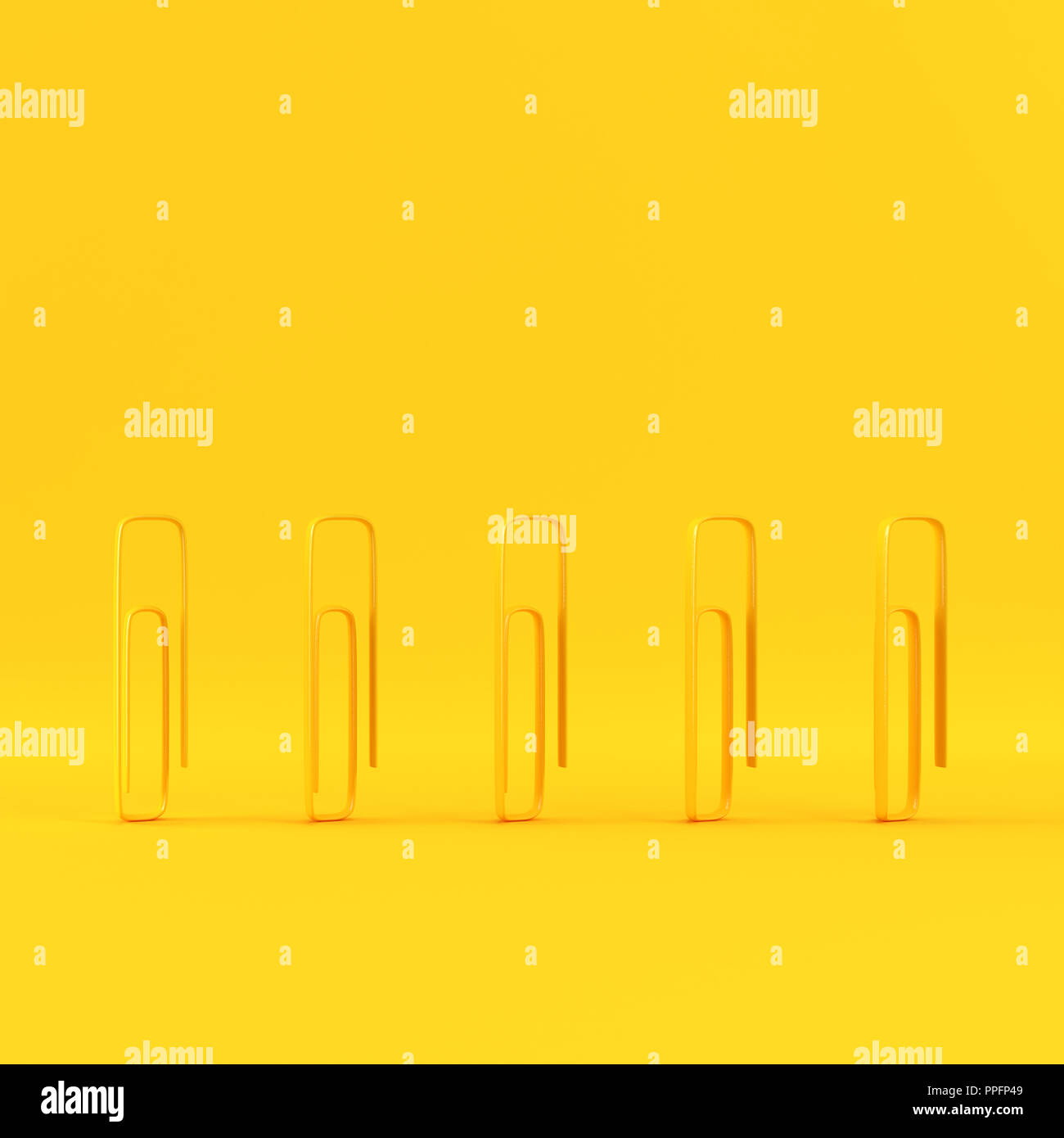 Paper clips on yellow background with copy space. Minimalism concept ...