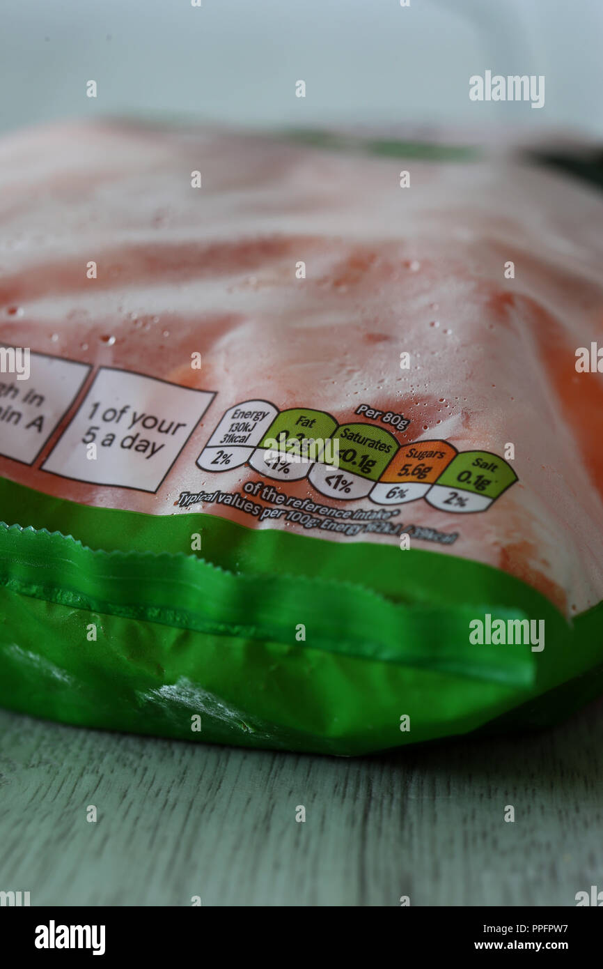 Food nutrition label on the front of a bag of frozen sliced carrots ...