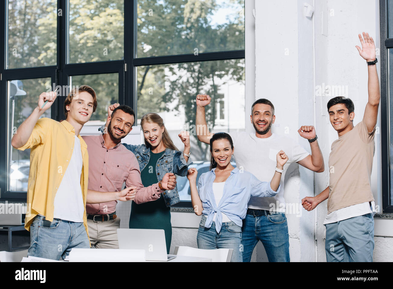 Excited male coworkers work hi-res stock photography and images - Alamy