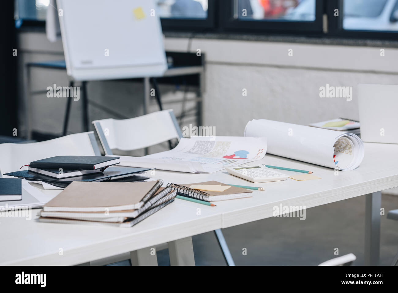 documents, notebooks and blueprints on table in office Stock Photo - Alamy