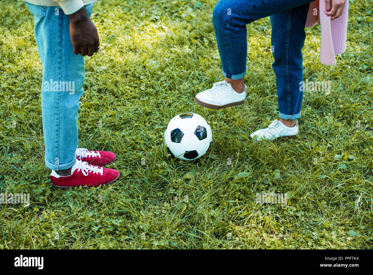 Adults playing soccer in the park hi-res stock photography and images ...