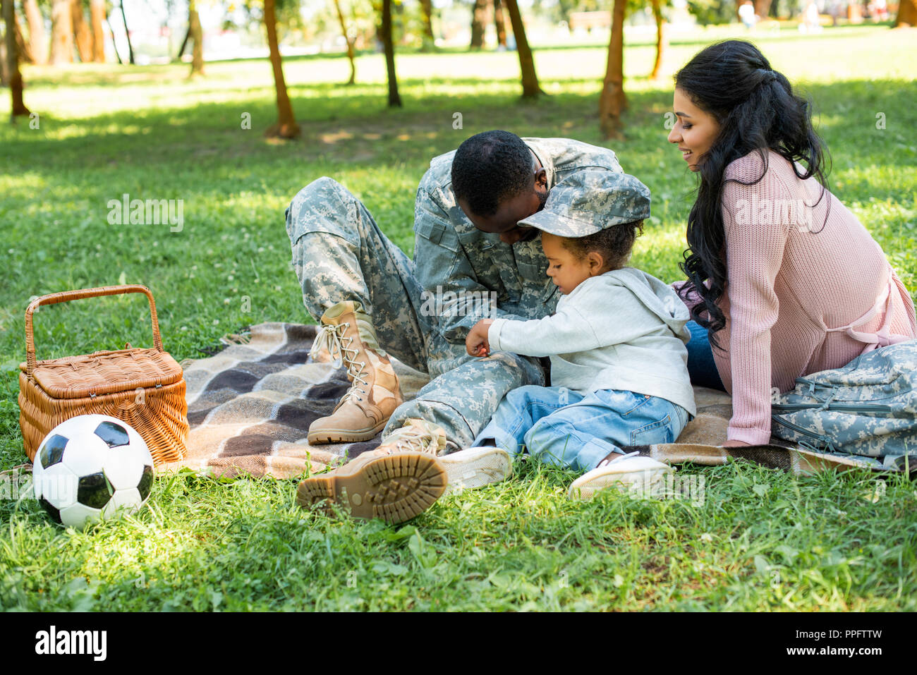 african american soldier in military uniform spending time with family ...
