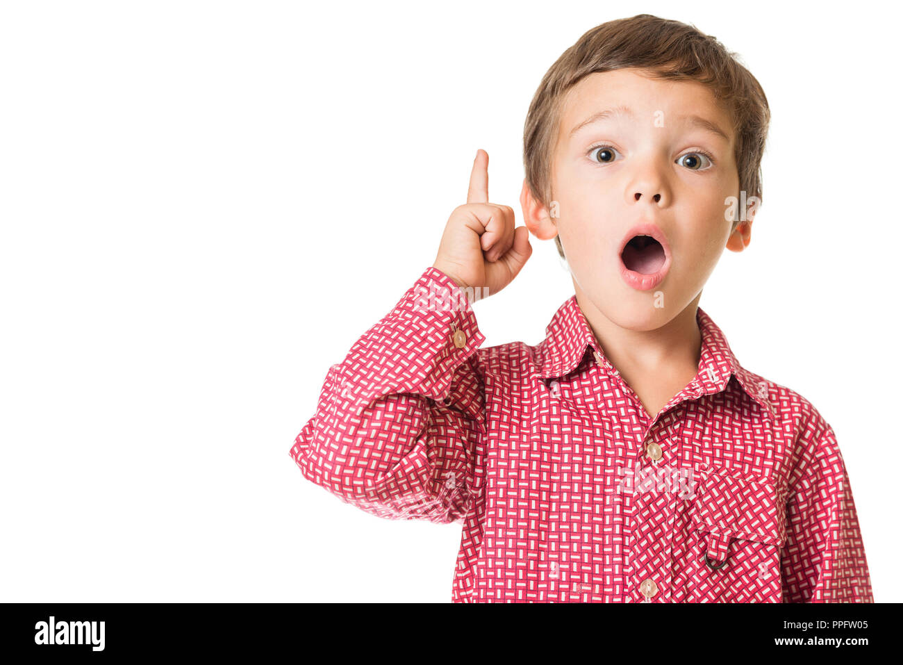 young adorable boy surprised with finger pointing upwards, isolated on ...