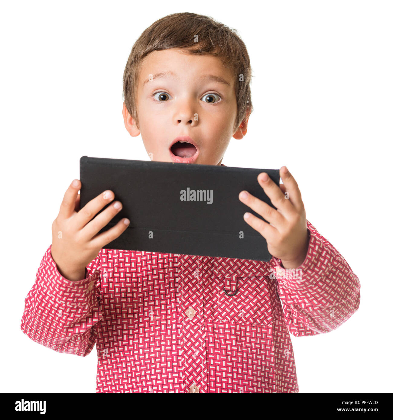 young surprised boy holding tablet, isolated on white background Stock ...