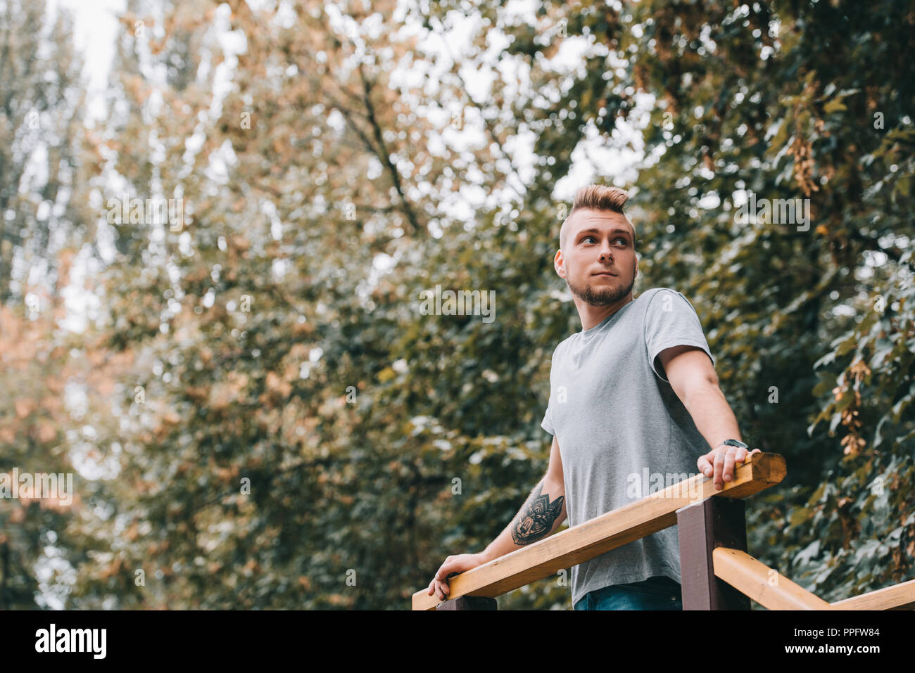 Man leaning railings hi-res stock photography and images - Alamy