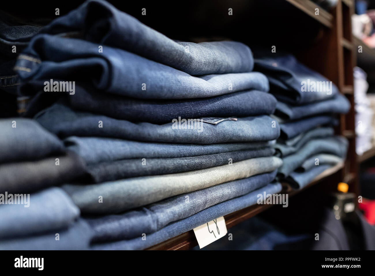 Shelves with jeans hi-res stock photography and images - Alamy