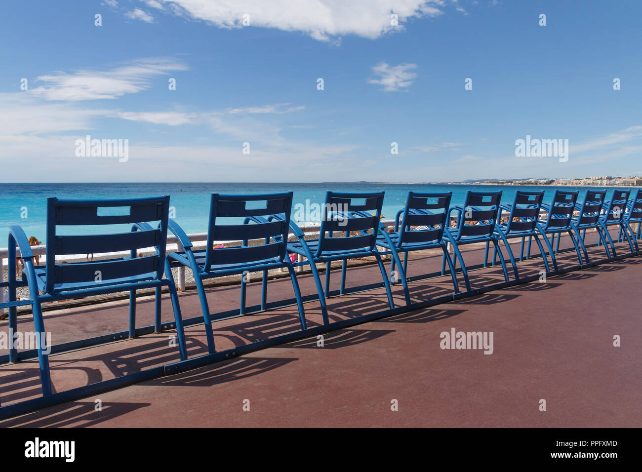 row of blue chairs on quay in Nice, France Stock Photo - Alamy