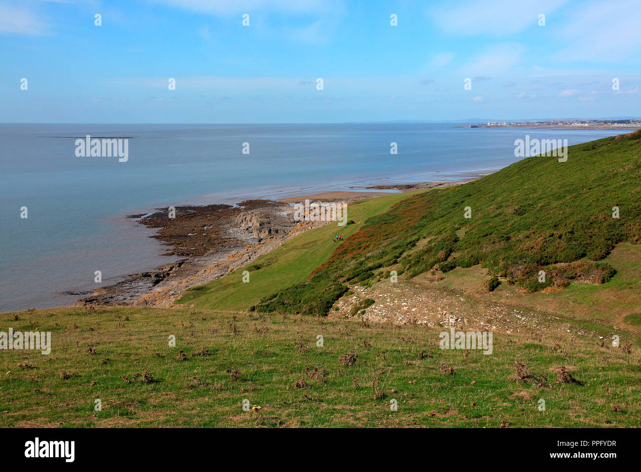 A view from the clifftop looking down onto the rocky promontary and ...