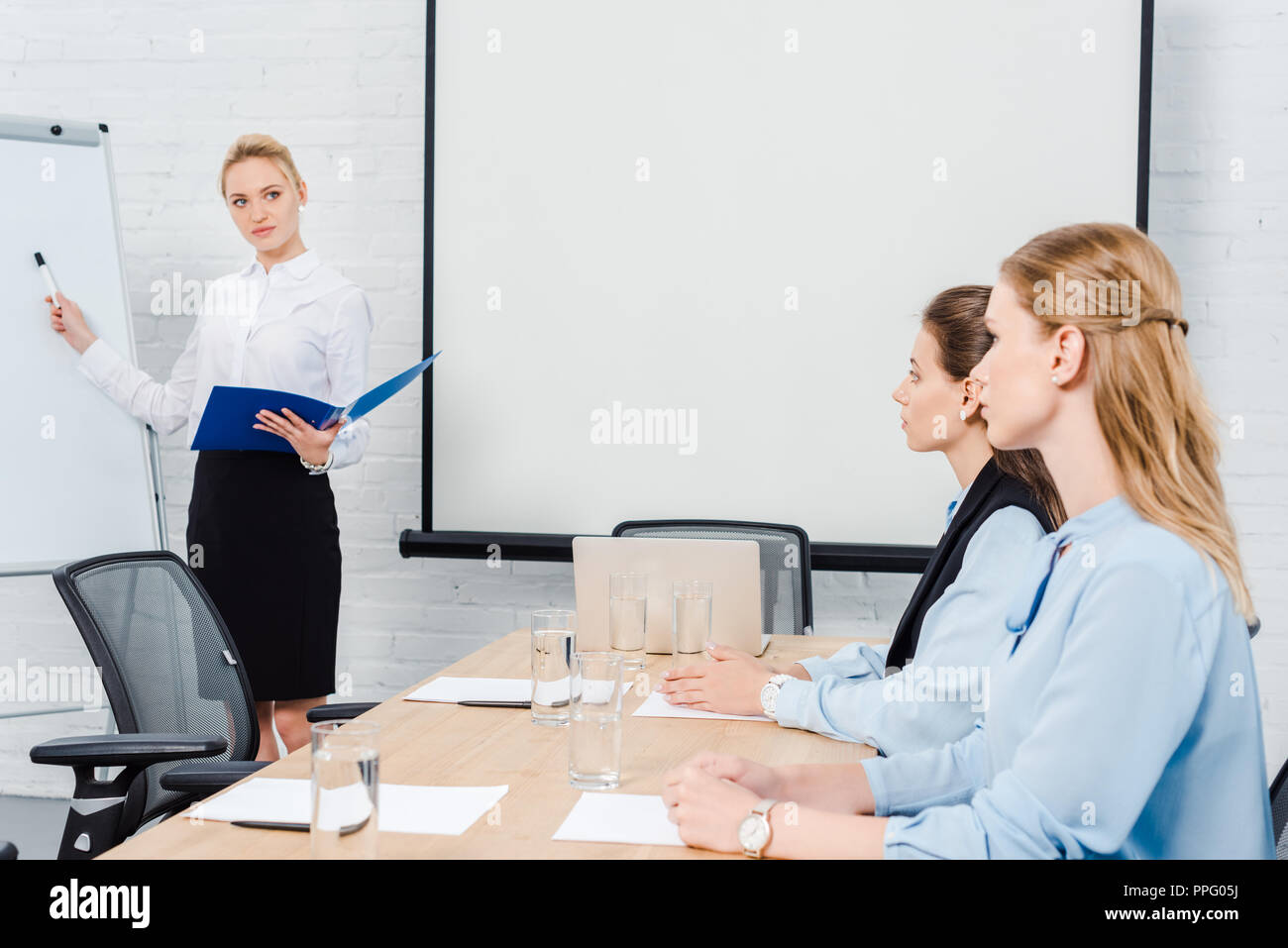 successful lady boss making presentation for employees during ...