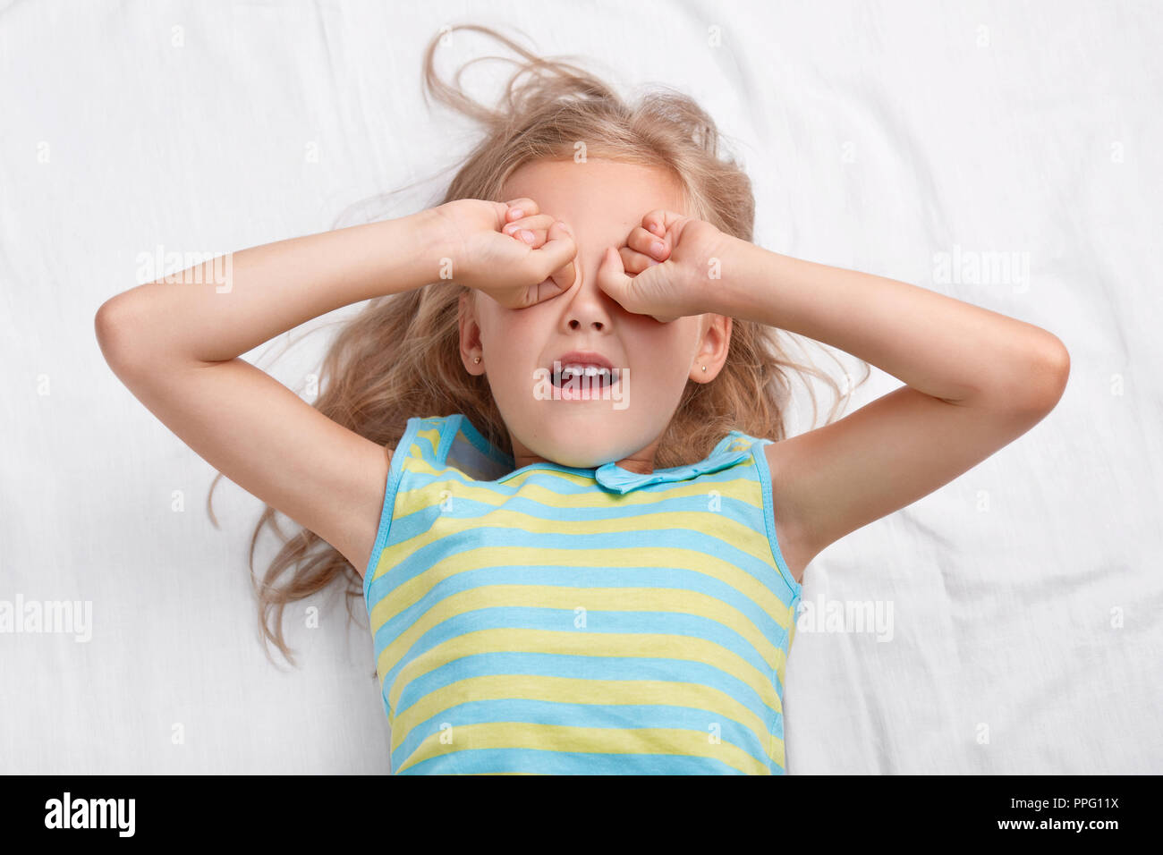 Child rubbing eyes bedroom hi-res stock photography and images - Alamy