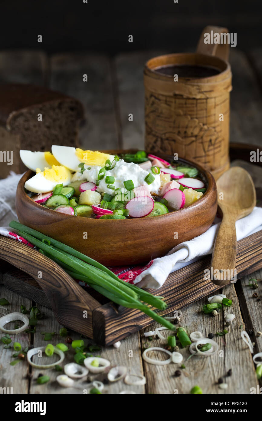 Russian traditional cold soup okroshka with potato, ham, cucmebers ...