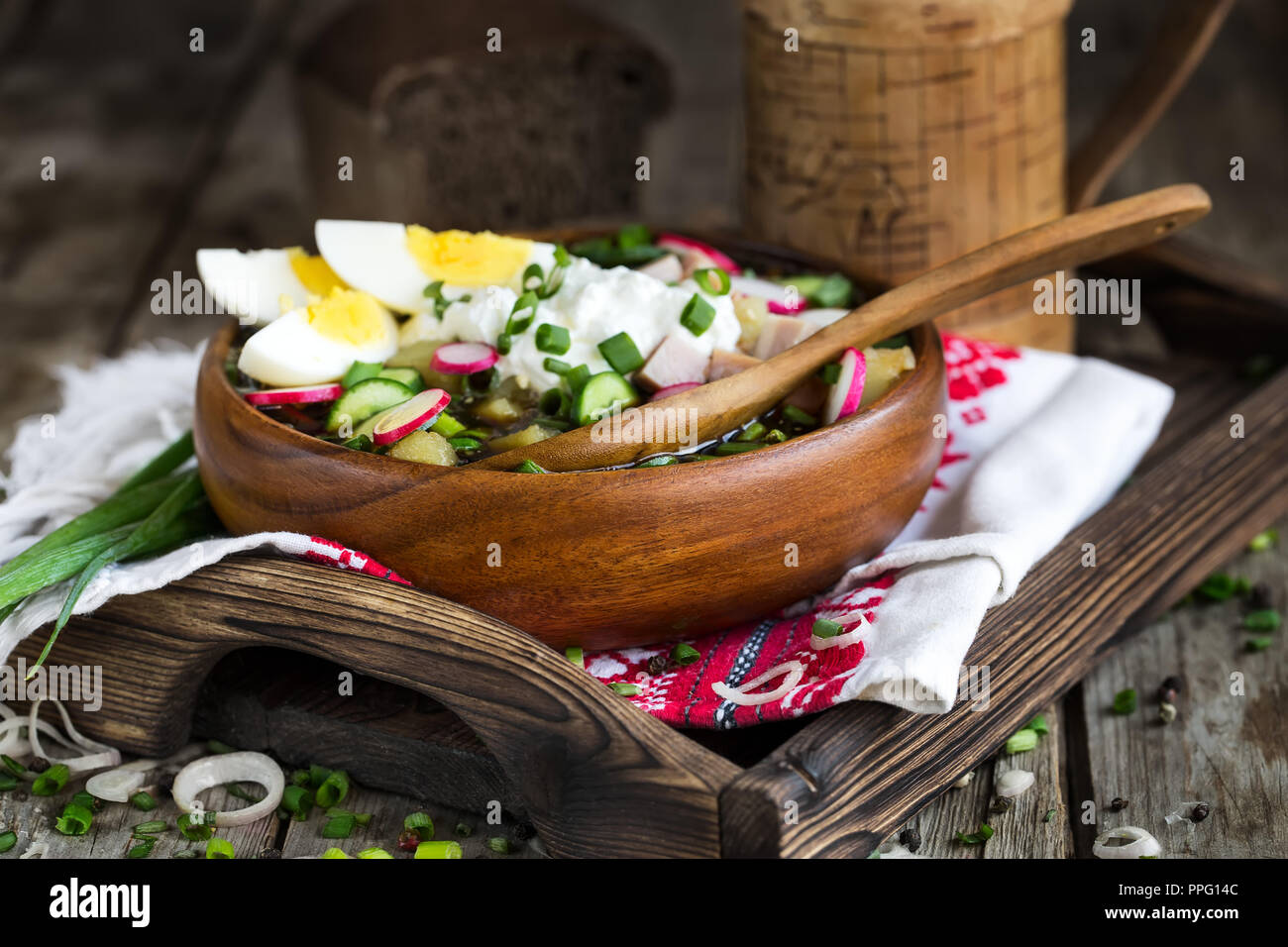 Russian traditional cold soup okroshka with potato, ham, cucmebers ...