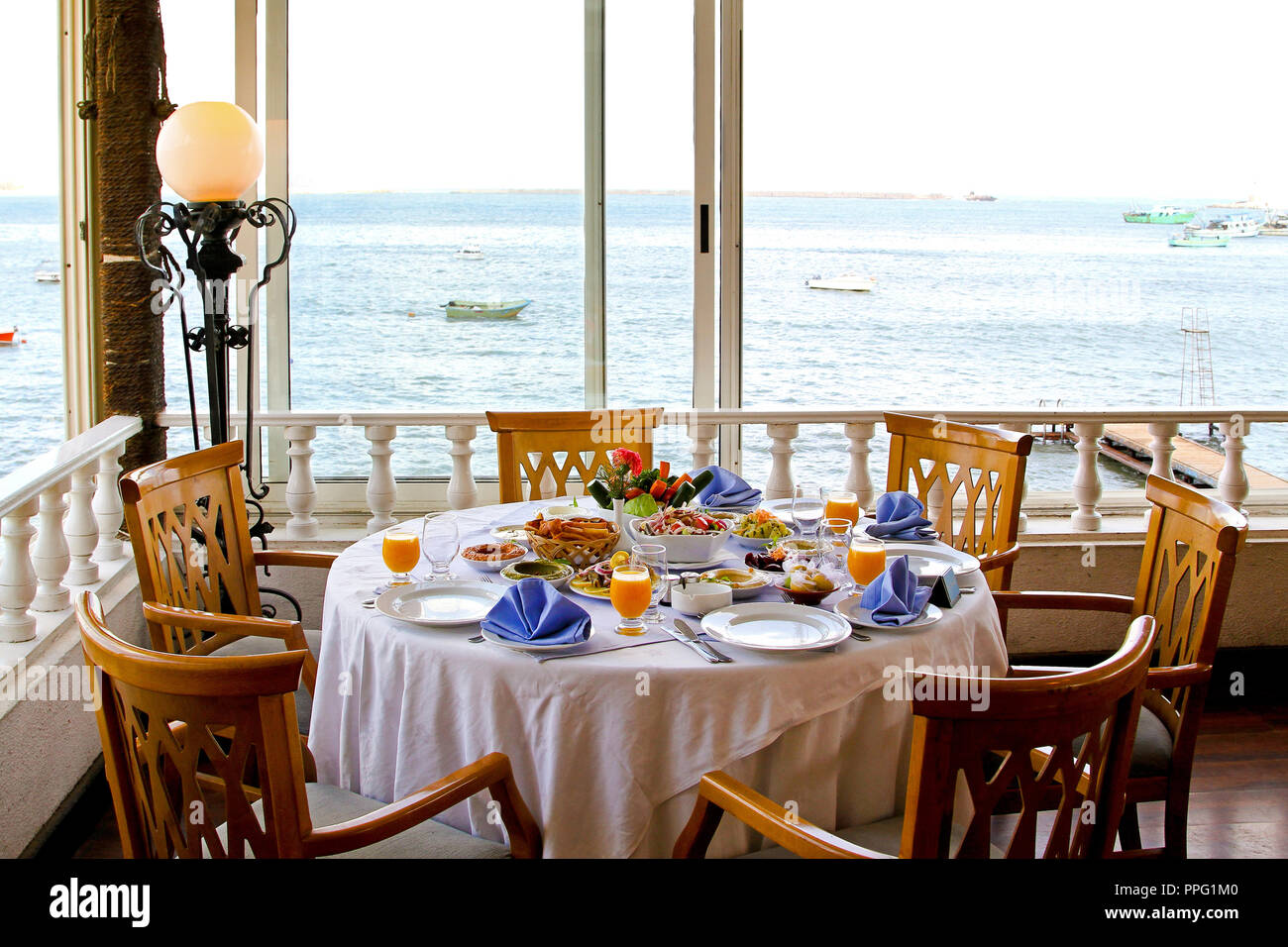Elegant set up table with tasty food Stock Photo - Alamy