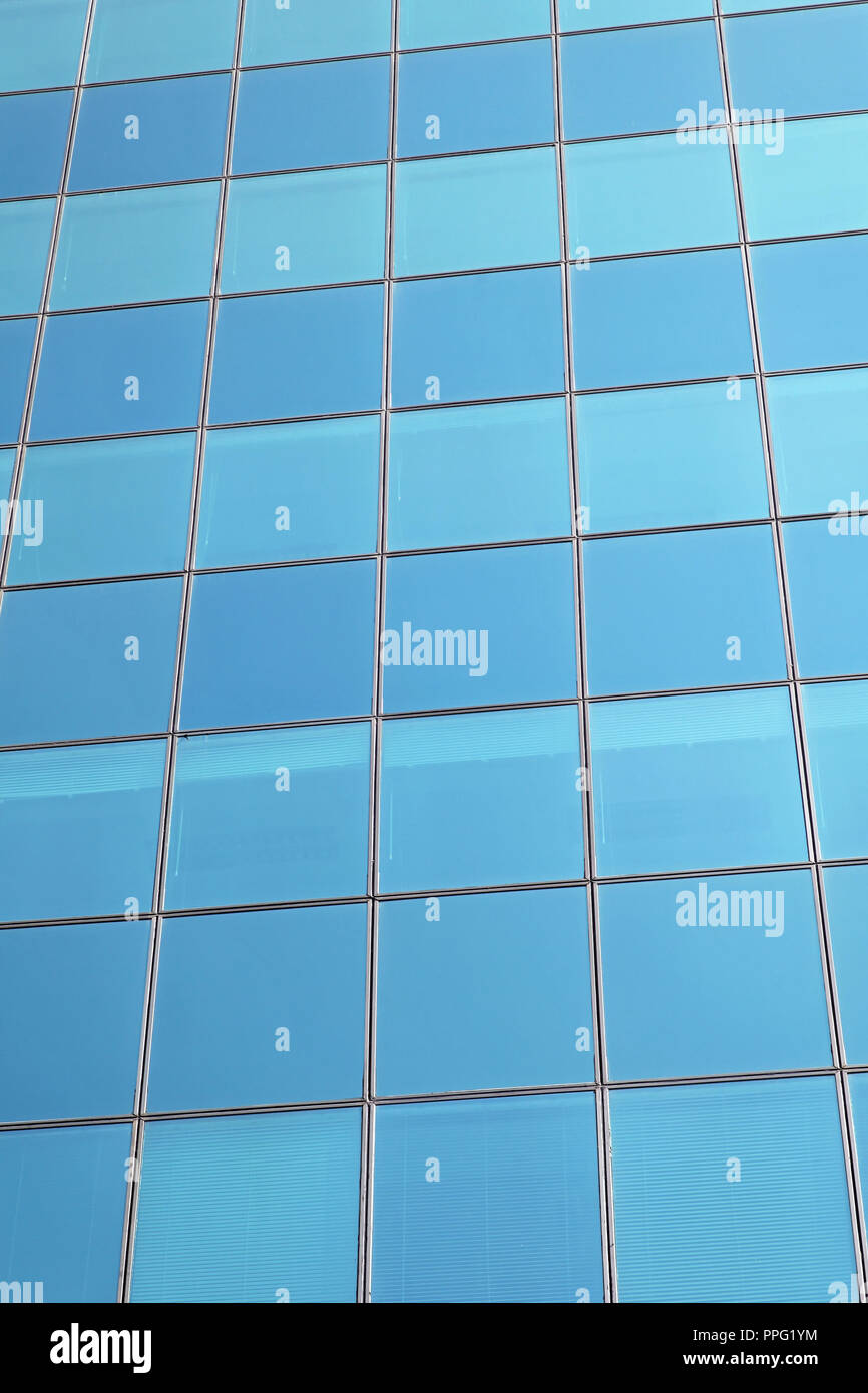 Modern building exterior with blue glass windows Stock Photo - Alamy