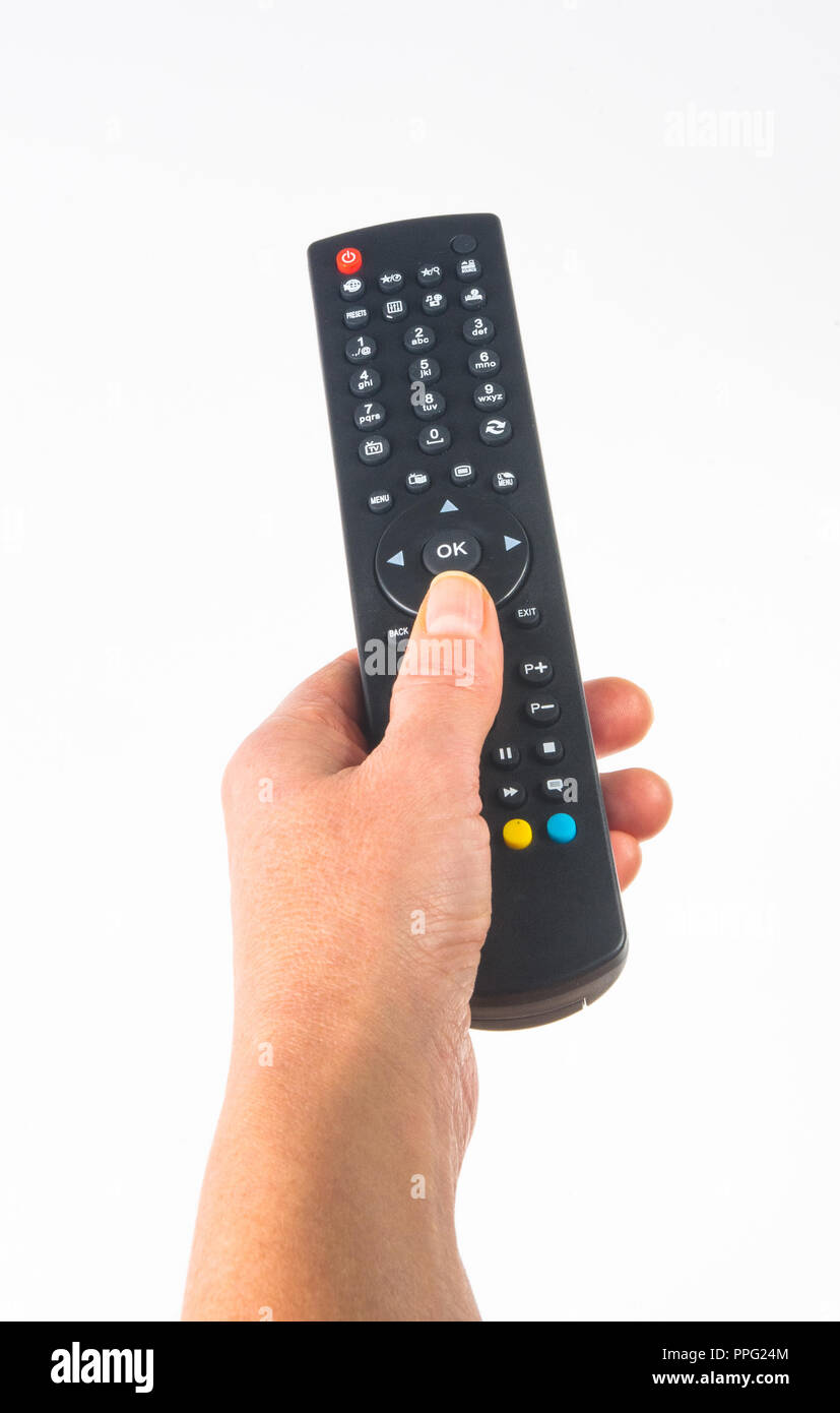 hand holding a remote control on white background Stock Photo - Alamy