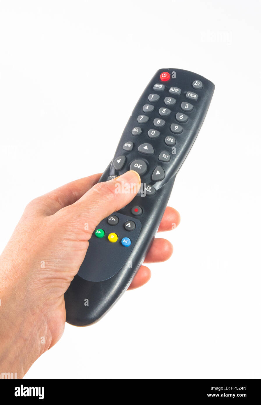 hand holding a remote control on white background Stock Photo - Alamy